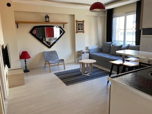 Suite Deluxe, Vista para a cidade | Lençóis de algodão egípcio, roupa de alta qualidade, minibar 