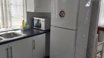 Apartamento, 2 quartos, varanda, vista para o jardim | Cozinha privada