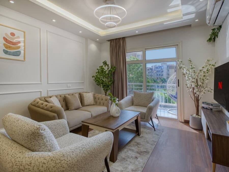 Apartamento luxo, vista para o jardim | Área de estar | Lareira