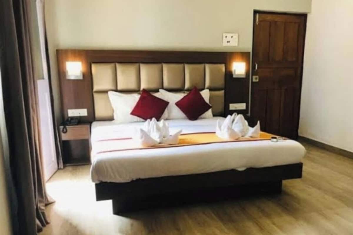 Quarto luxo, sacada, vista para o jardim | Roupas de cama premium, berços (sobretaxa), Wi-Fi de cortesia