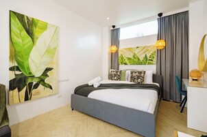 Suite Deluxe, pátio | 1 quarto, Wi-fi grátis