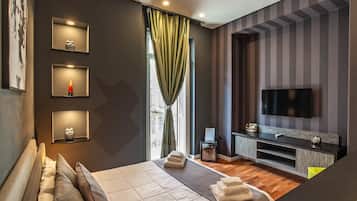 Camera tripla con balcone | Minibar, com decoração personalizada, com mobília individualizada