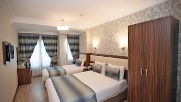 Roupa hipoalergénica, minibar, cofre no quarto, secretária