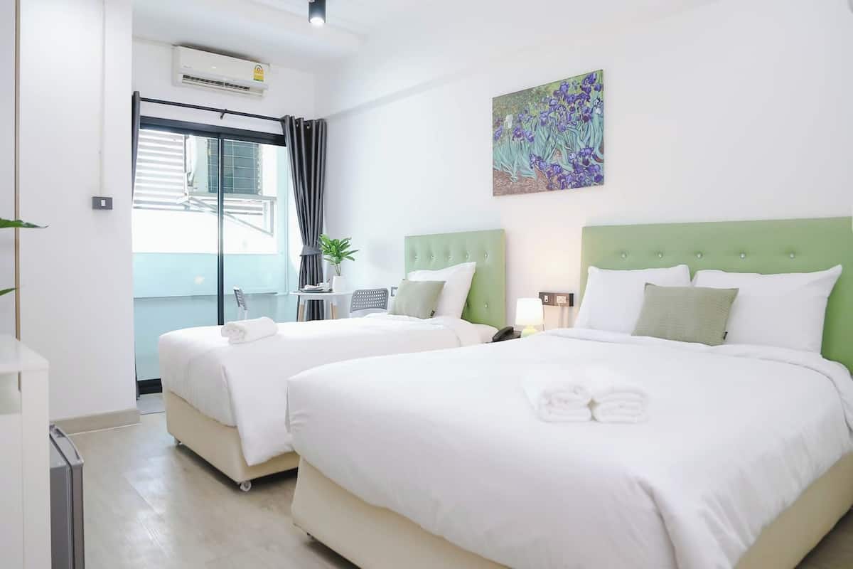 Quarto Triplo Deluxe | Roupa de cama fornecida