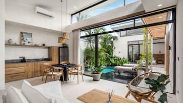 Villa Deluxe, 1 cama king-size, piscina privativa, vista para a piscina | Sala de estar