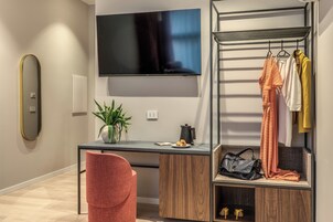 Roupas de cama premium, edredons de pluma, frigobar, cofres nos quartos