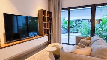 Apartamento conforto, vista para a cidade | Área de estar