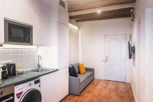 Apartamento | Área de estar | TV 50 cm com canais a cabo