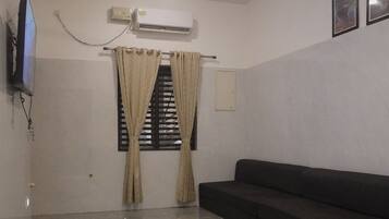Apartamento Deluxe | Sala de estar
