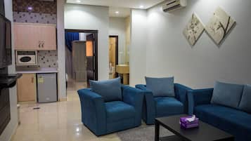 Apartamento, 1 quarto | Área de estar | TV de tela plana