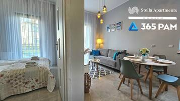 Apartamento conforto | Área de estar | TV LCD 50 polegadas com canais a cabo