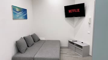 Apartamento Deluxe | Sala de estar