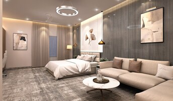 Quarto de hotel moderno com uma cama grande, um sofá, uma mesa de centro de mármore e obras de arte nas paredes.