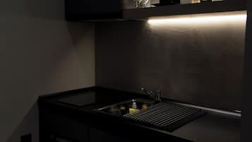 Suíte estúdio, vista para o jardim, no piso térreo | Cozinha privada