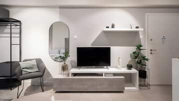 Suíte estúdio superluxo, sacada | Área de estar | TV 42 polegadas com canais a cabo