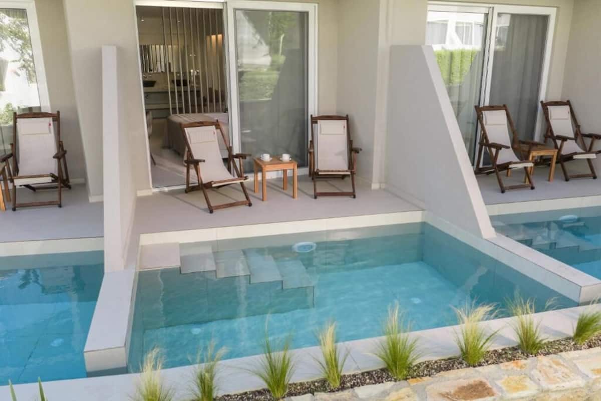 Suite Júnior, 2 camas individuais | Minibar, Wi-fi grátis, roupa de cama fornecida