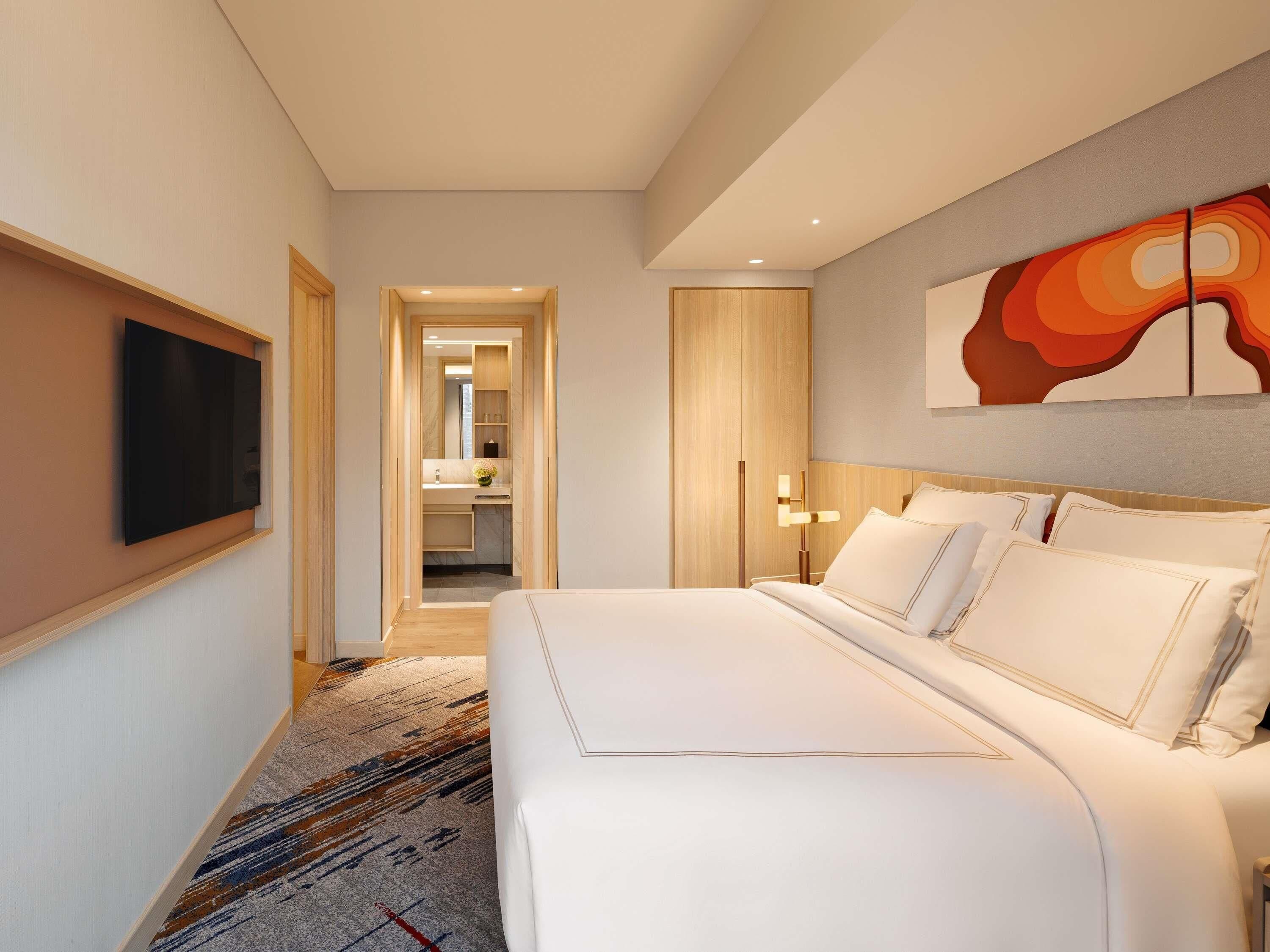 Suíte executiva | Roupas de cama premium, camas Select Comfort, cofres nos quartos