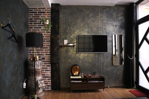 Estúdio | Sala de estar | Televisor LED de 40 polegadas com canais por cabo 