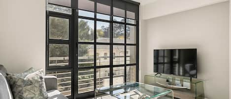 Apartamento | Área de estar | TV de tela plana