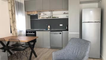 Suíte luxo, 1 quarto, sacada, vista para o mar | Área de estar
