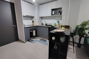 Apartamento | Cozinha privada | Mesas de jantar