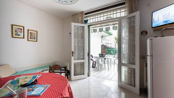 Apartamento, 2 quartos, vista para o jardim | Sala
