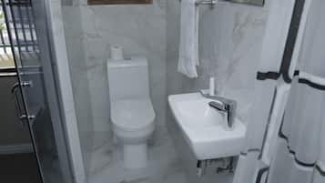 Quarto Deluxe | Casa de banho | Toalhas fornecidas, sabão, champô, papel higiénico