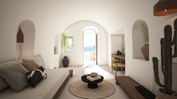 Uma sala de estar minimalista com um sofá, uma mesa de centro e vista para o mar por uma porta em arco.