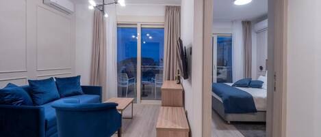 Suíte executiva, sacada, vista para a cidade | Área de estar