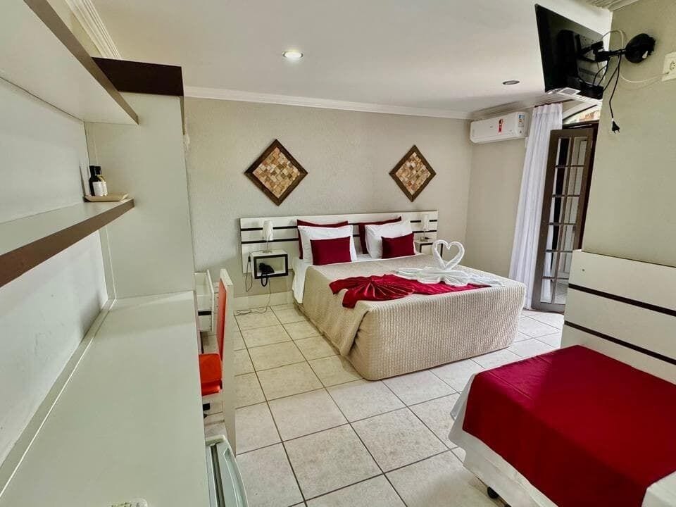 Quarto superluxo | Frigobar, Wi-Fi de cortesia, roupa de cama