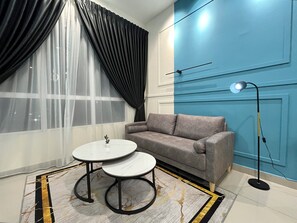 Apartamento, 2 quartos | Área de estar