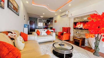 Apartamento Standard, varanda, vista para a praia | Sala