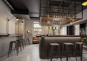 Uma área de bar com banquetas, balcão e torneira de cerveja.