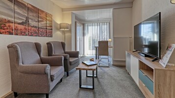 Suite, 1 cama de casal, não fumadores | Sala de estar