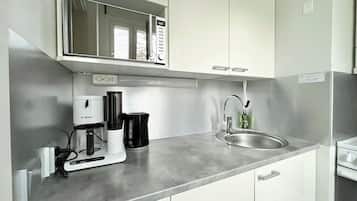 Apartamento Comfort | Cozinha privada | Uma chaleira elétrica