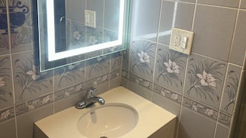 Quarto empresarial | Banheiro | Sabonete, shampoo