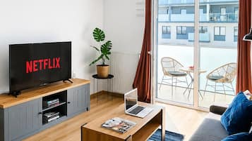 Apartamento Comfort, Vista para a cidade | Sala de estar | Televisor