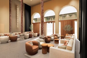 Um hall amplo com várias áreas de estar, janelas grandes e design arquitetônico moderno.