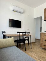 Apartamento luxo, 1 cama de casal e sofá-cama, sacada, vista para a cidade | Parte interna