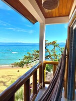 Suíte conforto, vista para a praia | Terraço/pátio