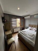 Suíte econômica, vista para a cidade | Wi-Fi de cortesia, roupa de cama