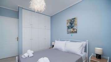 Apartamento Deluxe, Vista para a cidade | 3 quartos, roupa de alta qualidade, cortinas/cortinados opacos
