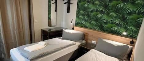 Apartamento básico, 2 camas de solteiro, para não fumantes, cozinha americana | 1 quarto, ferros/tábuas de passar roupa, Wi-Fi de cortesia