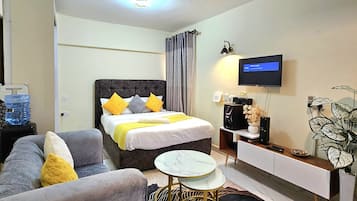Apartamento superior, vista para a cidade | 3 quartos, ferros/tábuas de passar roupa, Wi-Fi de cortesia
