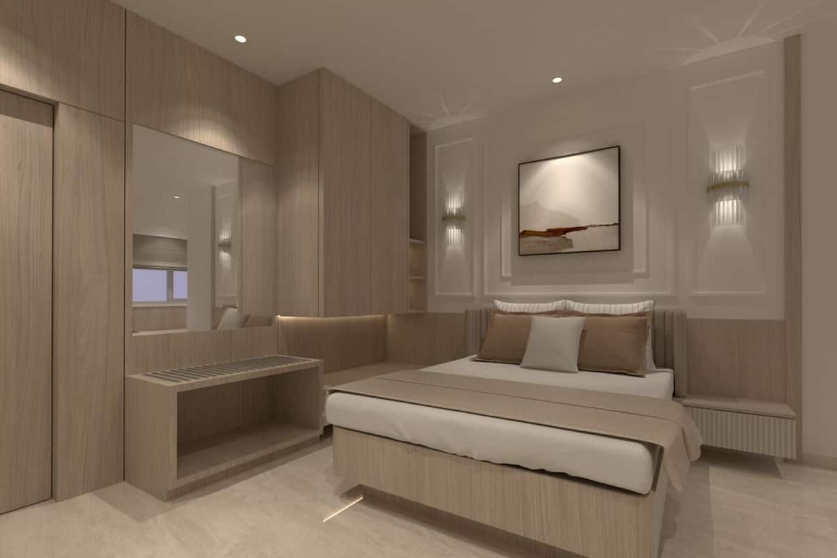 Quarto moderno com uma cama grande, um banco embutido e uma obra de arte na parede.