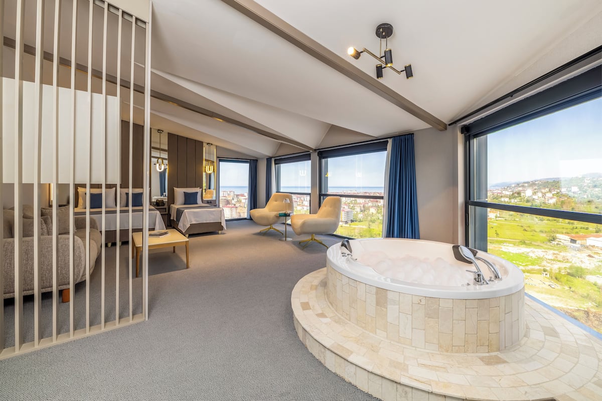 Suite, vista para o mar | 1 quarto, cofre com capacidade para portátil, secretária