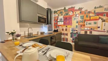 Apartamento família | Cozinha privada | Cadeirão de bebê