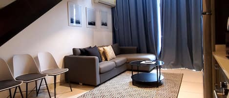 Apartamento Premium | Sala de estar | Televisor