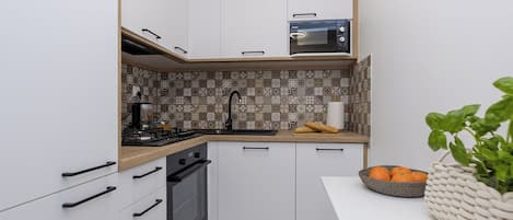 Apartamento clássico, sacada, vista para a cidade | Cozinha privada