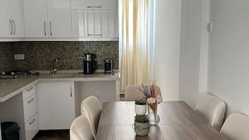 Suíte luxo, vista para o jardim | Área de estar